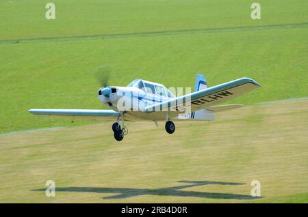 Varga 2150A Kachina taking off from the grass airstrip at a wings and ...