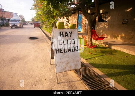 Street sign announcing coconut ice cream in the city of Tarapoto in the ...