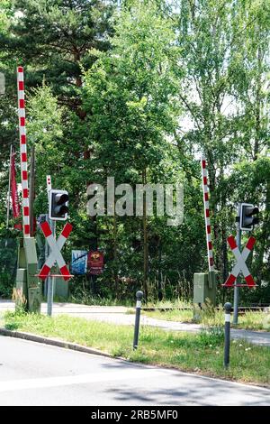 St Andrew's cross at a level crossing with a view of the tracks, which ...