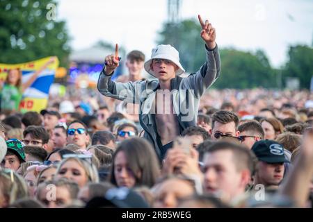 Festival goers watch George Ezra performing on the main stage at the ...