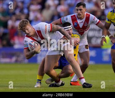 St Helens' George Delaney is tackled during the Betfred Super League ...