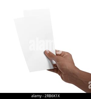Man holding flyers on white background, closeup. Mockup for design ...