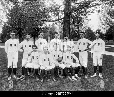 Notre Dame Fighting Irish players kneel in prayer in the enz zone before an NCAA college ...