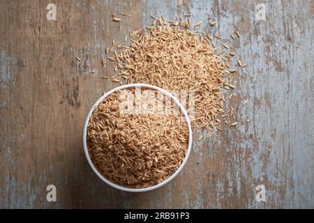 cup of paddy husk or rice husk, aka yellow rice chaff, rice husk or ...