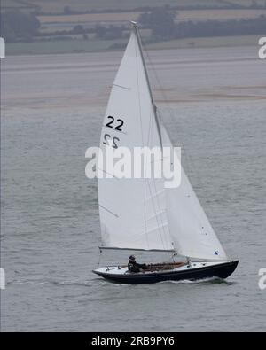 A Fife One Design yacht sailing off Beaumaris in the Menai Straits ...
