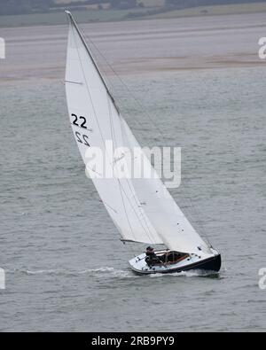 A Fife One Design yacht sailing off Beaumaris in the Menai Straits ...