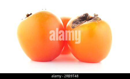 Red ripe persimmons rotating over white background Stock Photo - Alamy