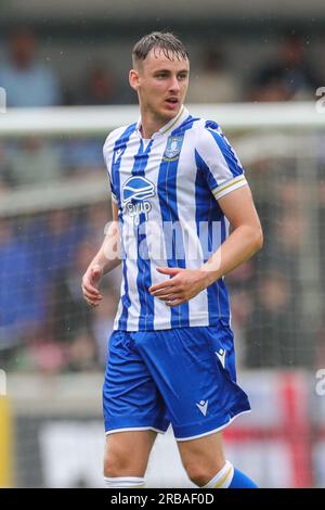 Ciaran Brennan #34 of Sheffield Wednesday inspects the water logged ...