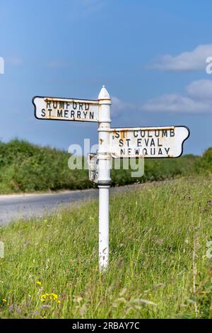Old signposts with place names on a country road in North Cornwall ...