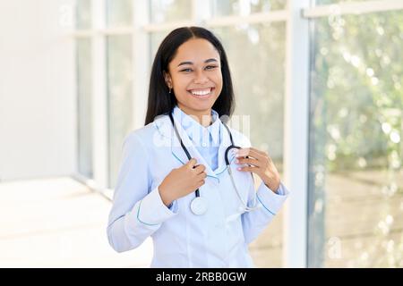 Cropped view of african american nurse holding hands of senior patient ...