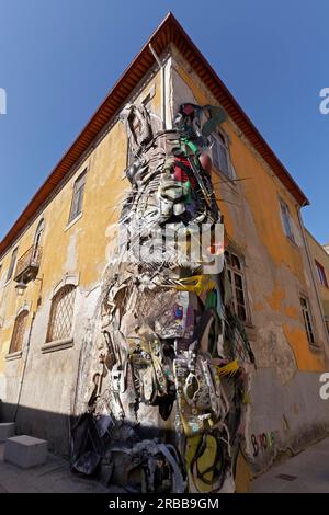 Half Rabbit, figure of a rabbit made of scrap and rubbish on the corner ...