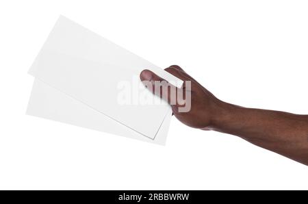 African American man holding flyers on white background, closeup ...