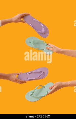 Hands with flip-flops on yellow background Stock Photo - Alamy
