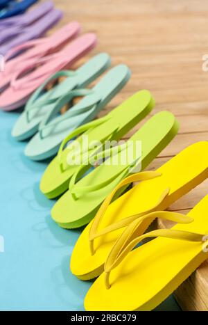 Many different flip flops on sand, flat lay. Space for text Stock Photo ...
