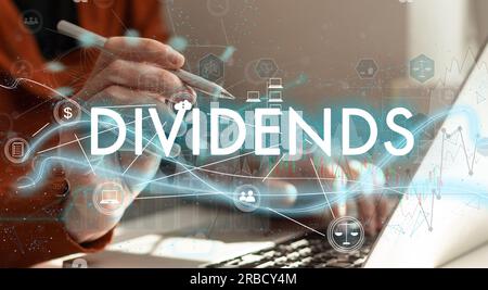 Business man drawing dividends on the virtual screen. Abstract ...