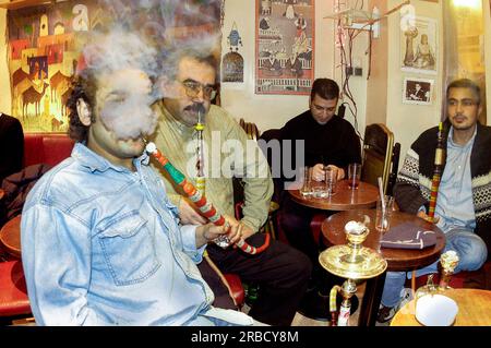 PARIS, Cafe, France - Arab Men Smoking Traditional Pipe Hookah in "Oum ...