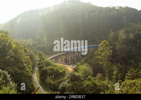 Train crosses Demodara nine arch bridge. Sri Lanka. Aerial background ...