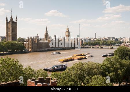 River Thames & Cory waste management company tug towing barges down ...
