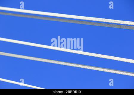 The ropes are brightly colored against the blue sky Stock Photo - Alamy