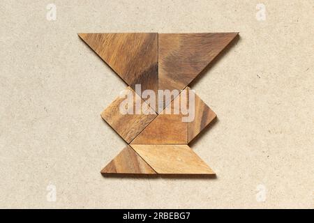 Tangram puzzle in vase or jar shape on wood background Stock Photo - Alamy
