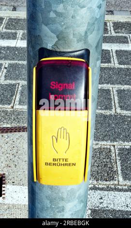 Yellow traffic light switch for pedestrian crossing Stock Photo - Alamy