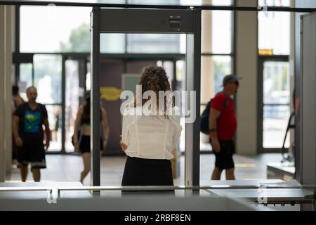 Security personnel checking bags and backpacks x-rayed at the access ...