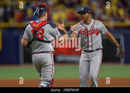 Atlanta Braves catcher Sean Murphy, left, and home plate umpire Jen Pawol, right, react after a ...