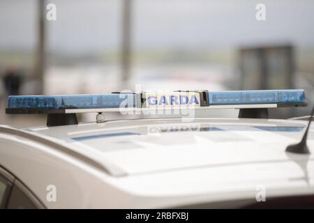 Garda/Irish Police sign and blue lights on a Garda/Police car with copy ...