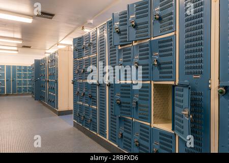 Old bent blue metal gym, gymnasium, lockers Stock Photo - Alamy