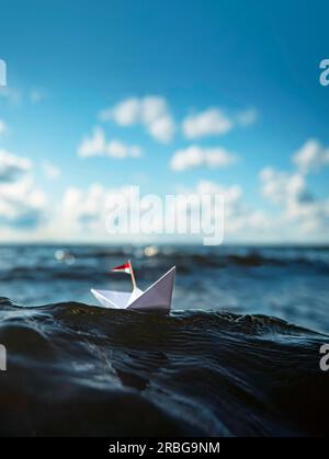 Sail away with paper boat Stock Photo - Alamy