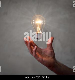 Glowing Vintage Light Pulp and Hand Stock Photo - Alamy