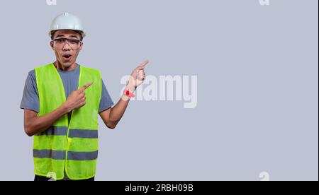 Surprised engineer pointing to the side. Surprised face construction ...