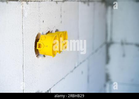 Yellow plastic recessed sockets, installation box for a socket in an ...