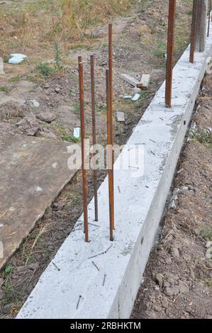 Fence footings. Close up on concrete footing metal building. Fence Post ...