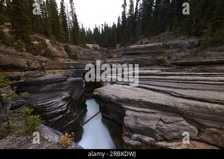 The Mistaya River flows through Mistaya Canyon in Banff National Park ...