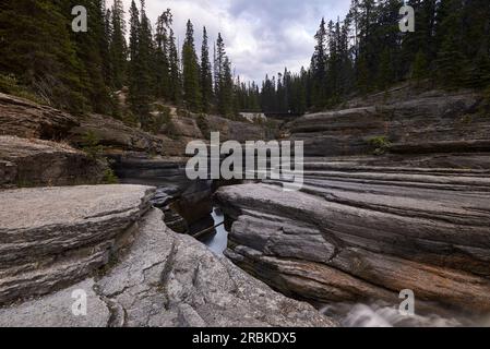 The Mistaya River flows through Mistaya Canyon in Banff National Park ...