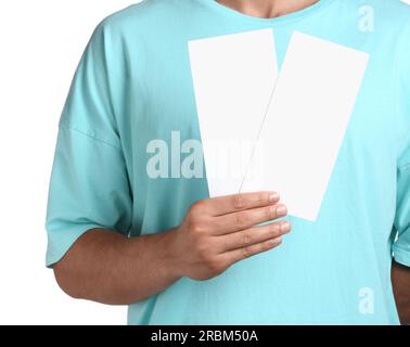 Man holding flyers on white background, closeup. Mockup for design ...