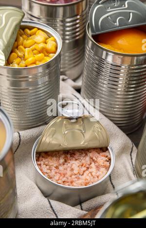 Open tin cans with different products, closeup Stock Photo - Alamy