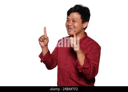 amazed asian student in eyeglasses looking away while walking in park ...
