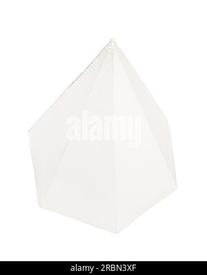 hand-crafted paper six-sided pyramid on turquoise blue background with ...