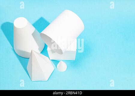 top view of various hand-crafted paper geometric solids close up on ...