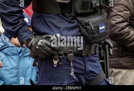 Equipment belt with gun and handcuffs on NYPD police woman Stock Photo ...