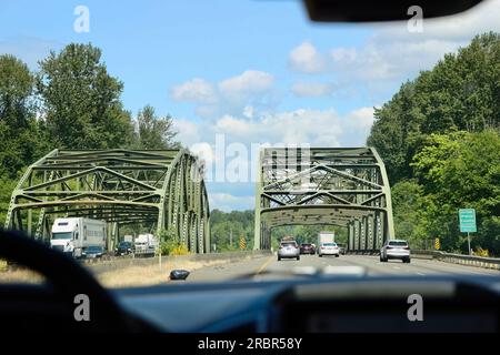 Traffic with steel warren type truss bridge on Interstate 5 North ...