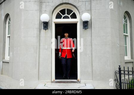 A sentry from the Canadian Ceremonial Guard stands in front of Rideau Hall, residence of the ...