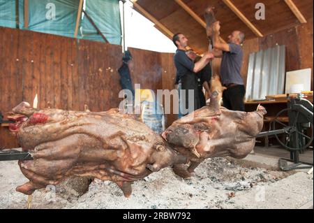 Porceddu, roast baby pork wrapped around a spit, typical Sardinia ...