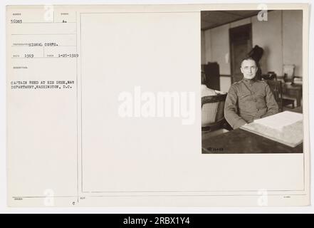 Captain Reed of the Signal Corps at his desk in the War Department ...