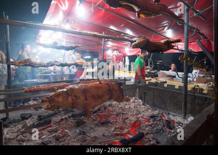 Porceddu, roast baby pork wrapped around a spit, “Cordula” made up of ...