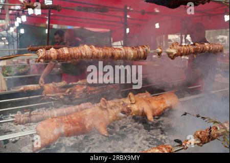 Porceddu, roast baby pork wrapped around a spit, “Cordula” made up of ...