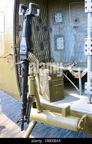 Machine gun on a UH-1H Huey helicopter Stock Photo - Alamy