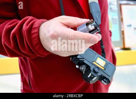 Series of photos showing the loading of a 35mm film into a Nikon Single ...